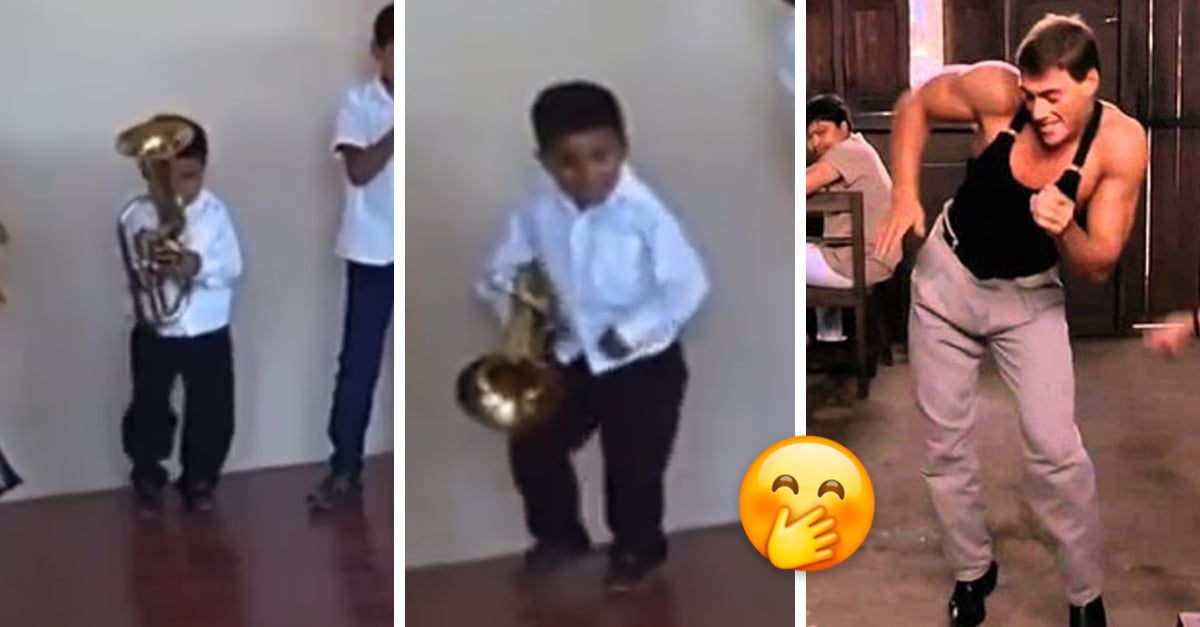 Cuteness! Child dances to the rhythm of the school band; he carries the ...