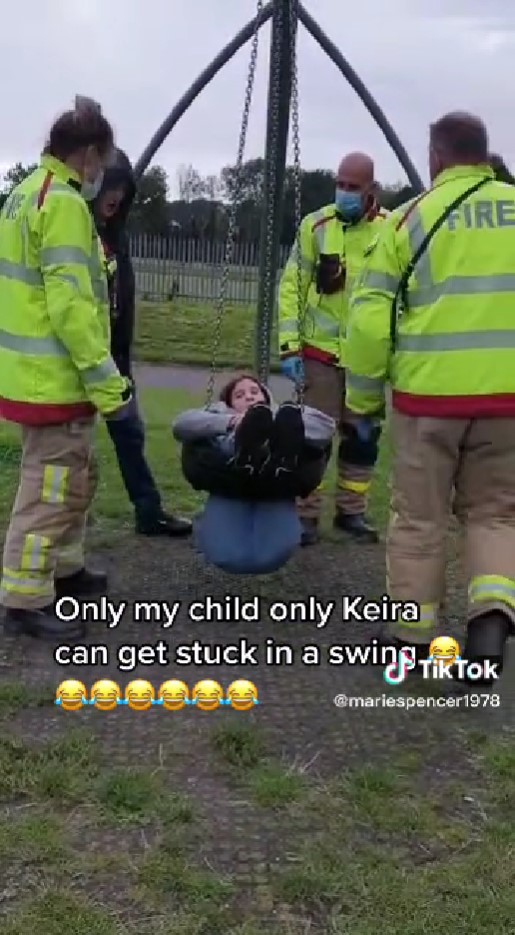 Girl gets stuck in a tire swing and firefighters had to rescue her ...